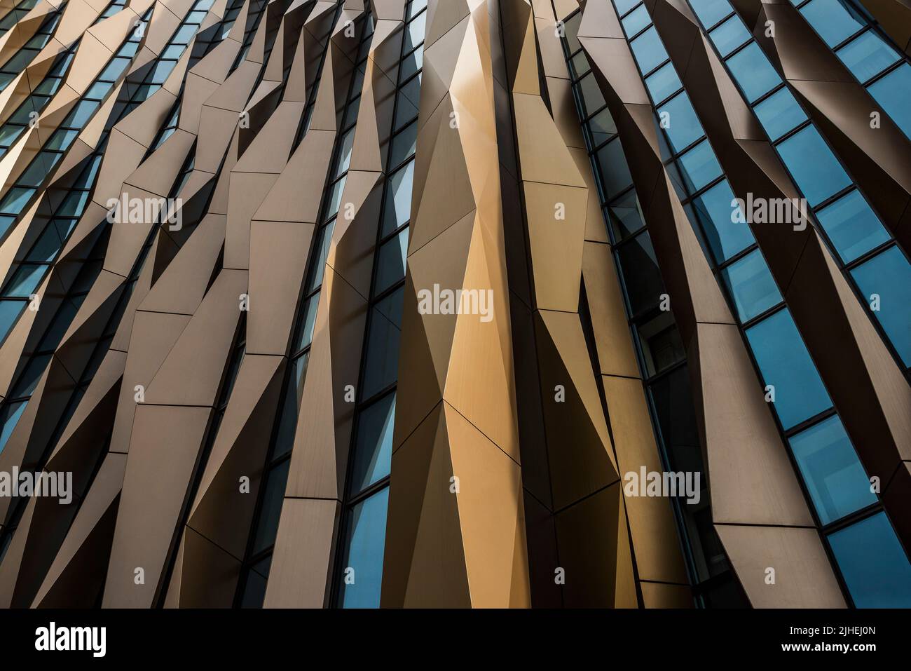 City residential building with crystalline style cladding. Abstract ...