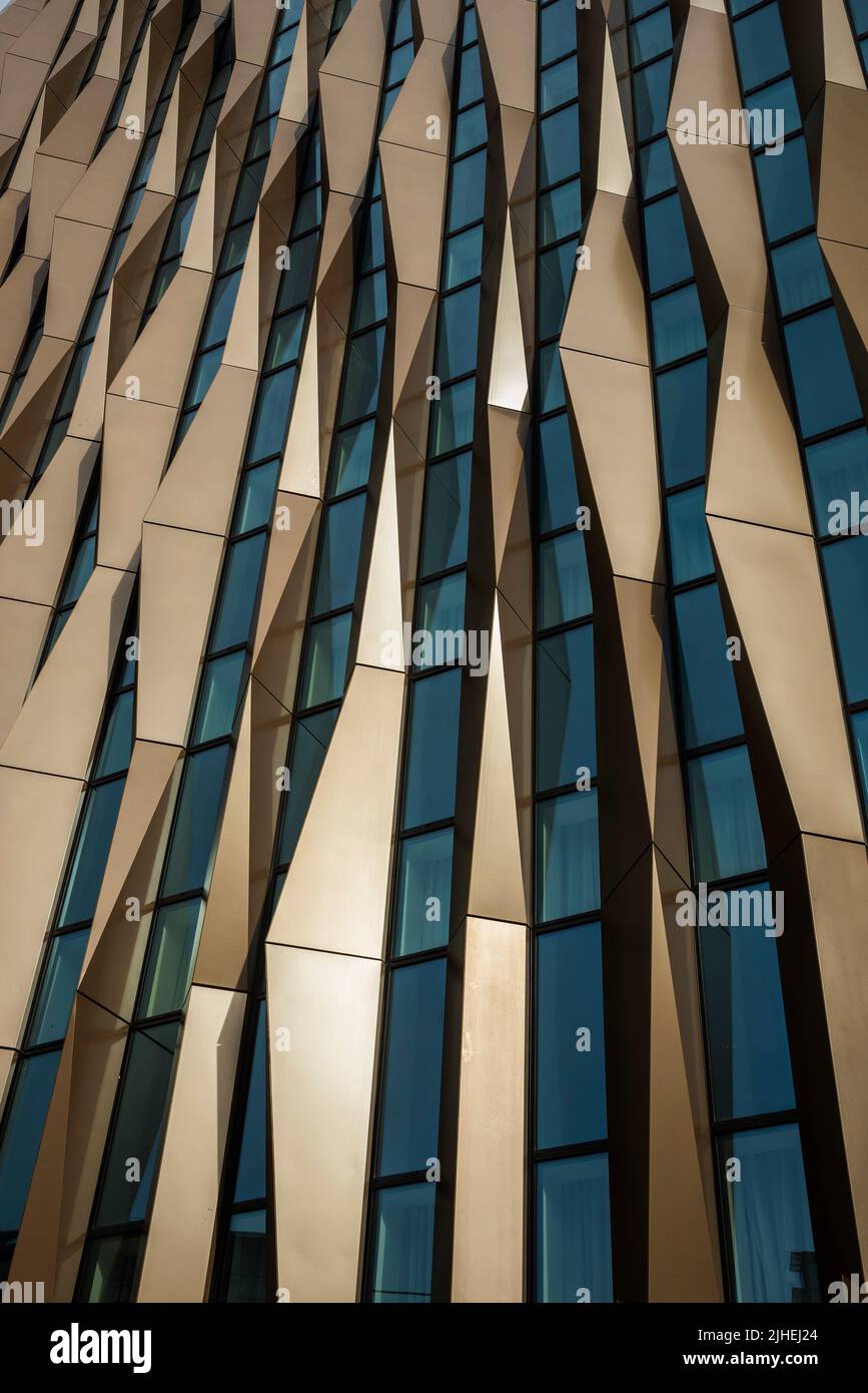 City residential building with crystalline style cladding. Abstract ...