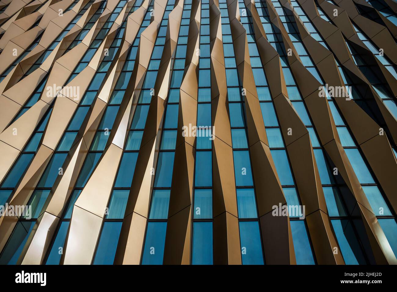 City residential building with crystalline style cladding. Abstract ...