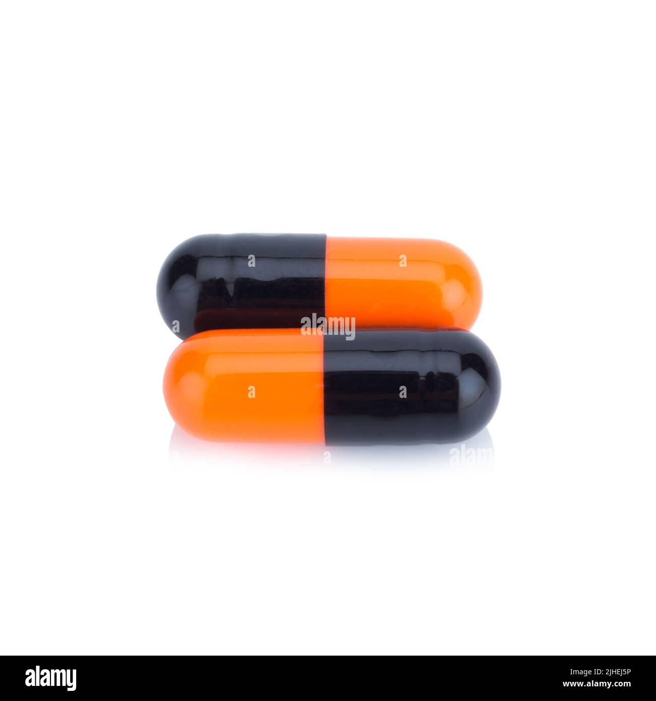 Two capsule color Black and Orange isolated on white background Stock ...