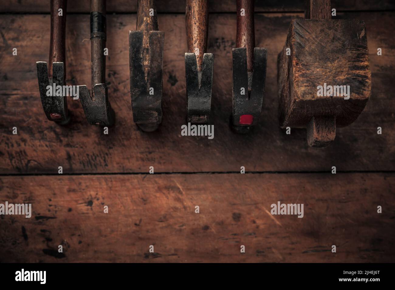 table view of set of vintage woodworking tools on a rough workbench ...