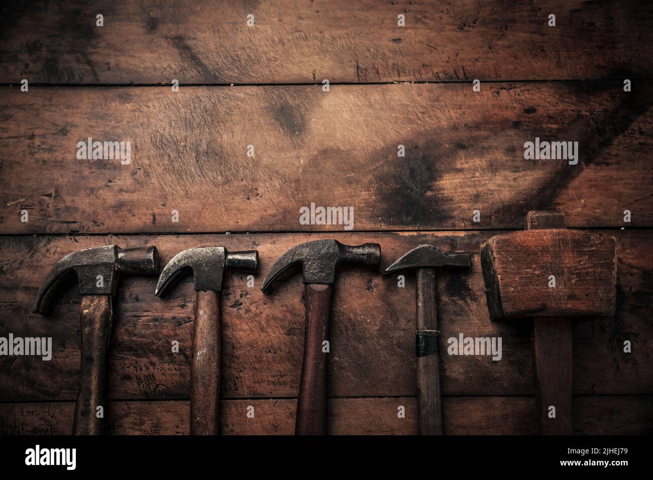 flat lay picture of rusty carpenter equipment hammers on top of ...