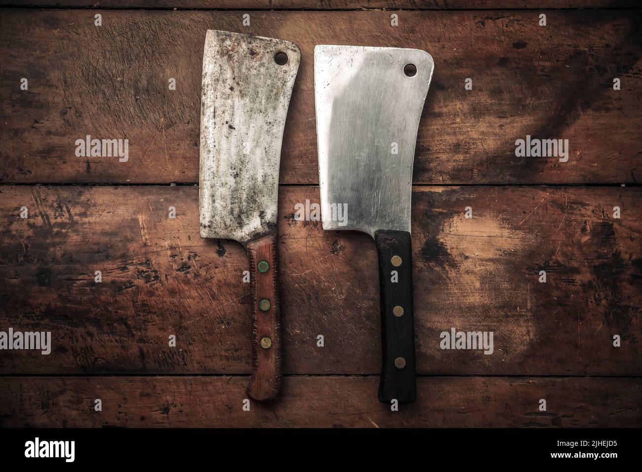 rustic vintage meat cleavers on top of wooden table flat lay picture ...