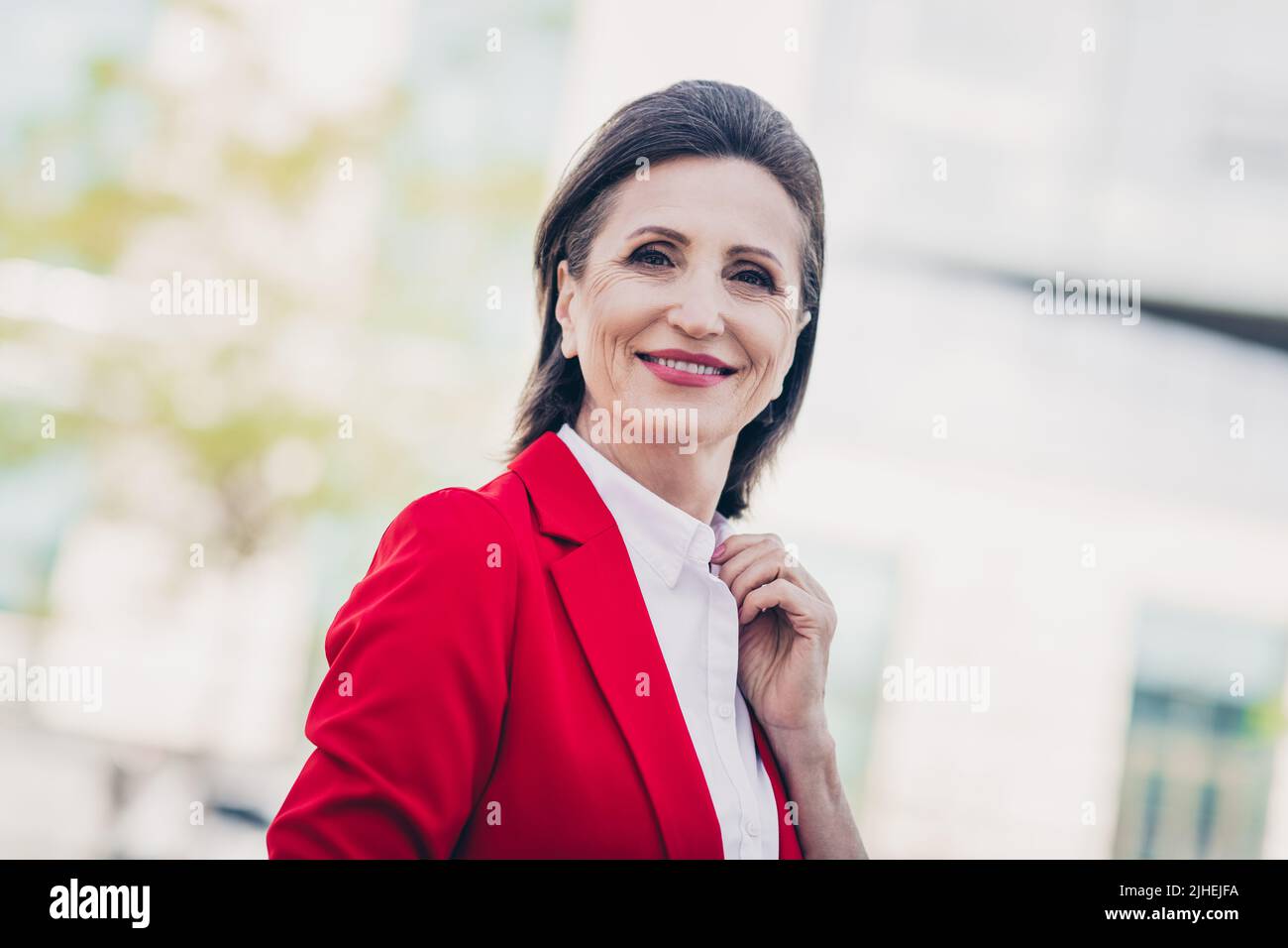 Photo of charming sweet mature lady leader wear red jacket walking ...