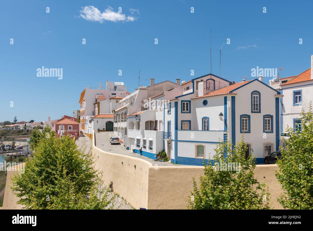 The view of the colorful typical houses in the city of Sines on a sunny ...