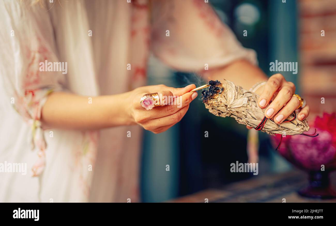 incense in a woman hand, ceremony space Stock Photo - Alamy