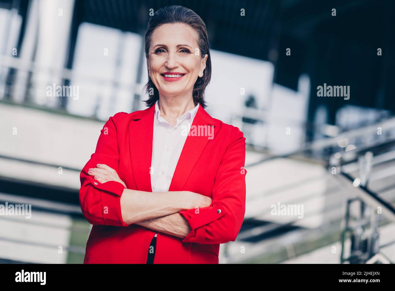 Photo of pretty confident mature lady ceo wear red jacket arms folded ...