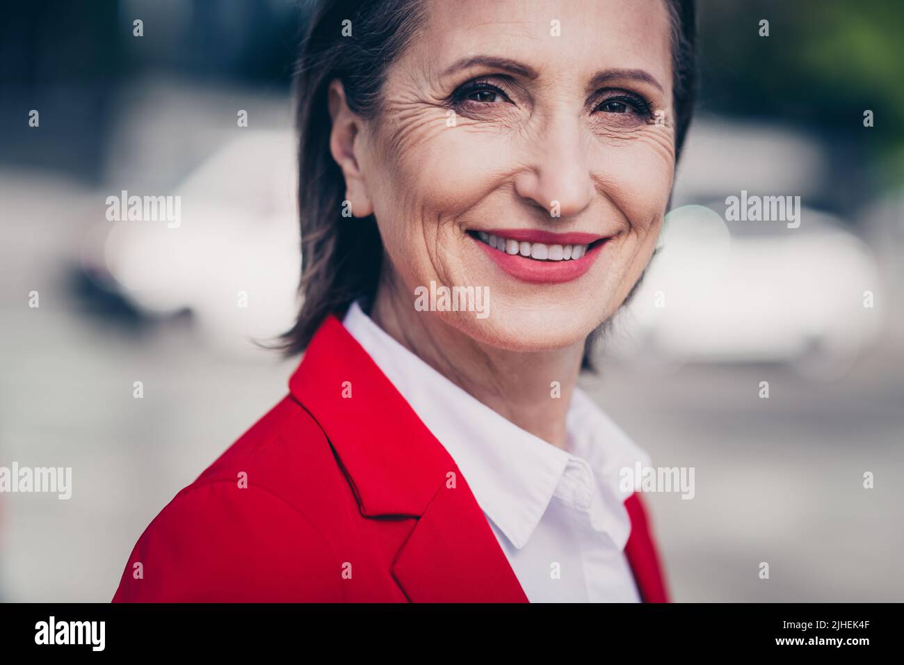 Photo of cheerful good mood mature lady leader wear red jacket smiling ...