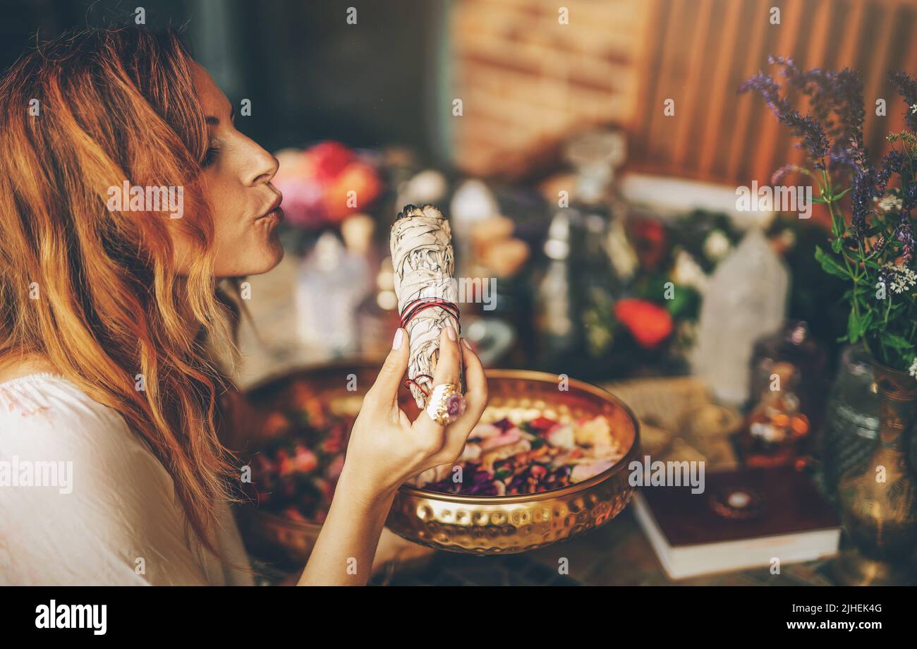 incense in a woman hand, ceremony space Stock Photo - Alamy