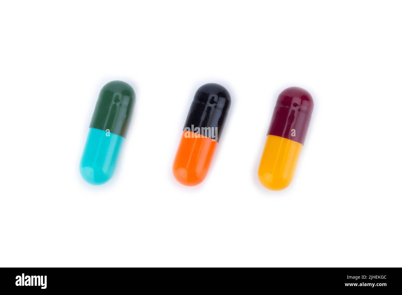 Three capsule color Red Yellow Blue Green Orange and Balck isolated on ...