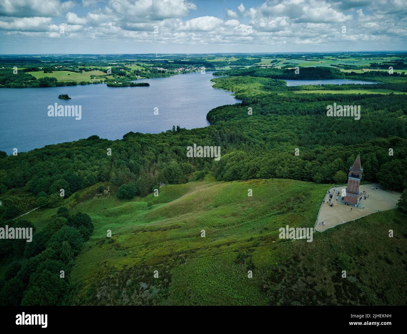 An aerial view of an old church on lush green Himmelbjerget hill in ...