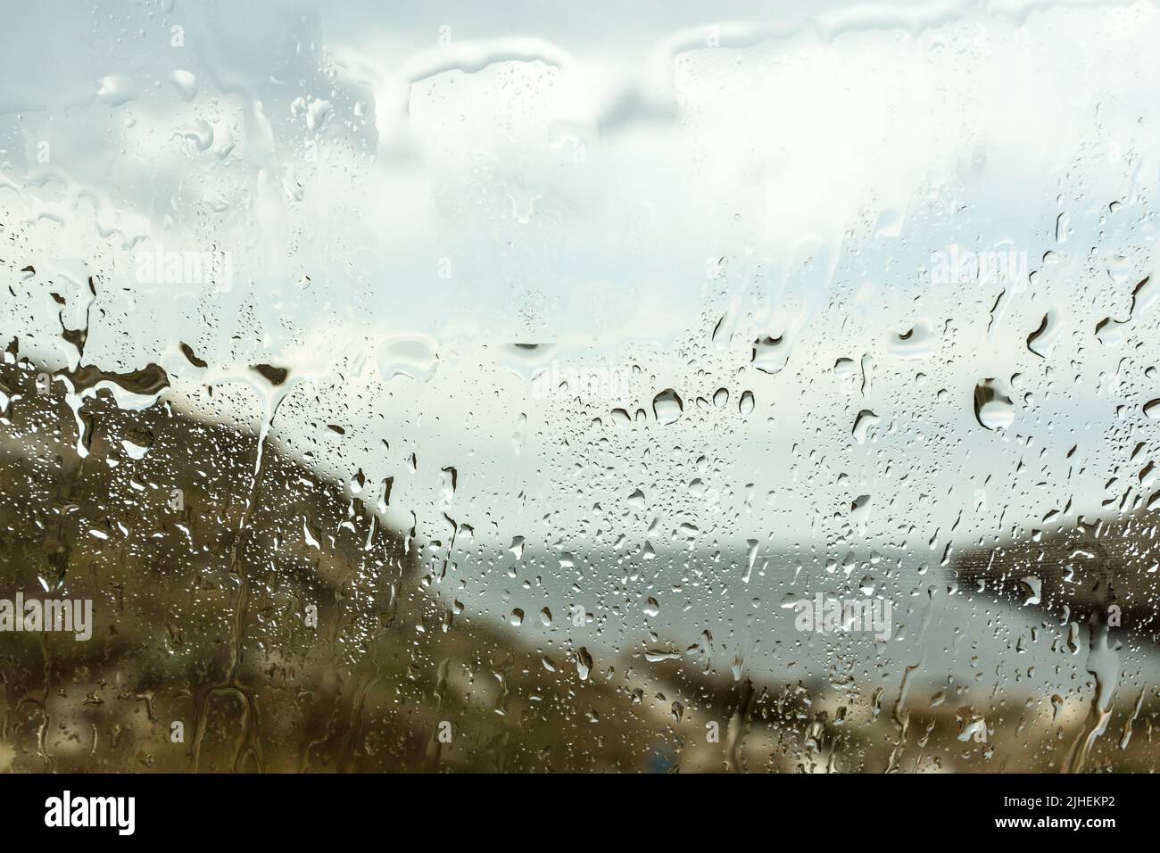 Blurred rain drop on the car glass background, water drops at the car ...