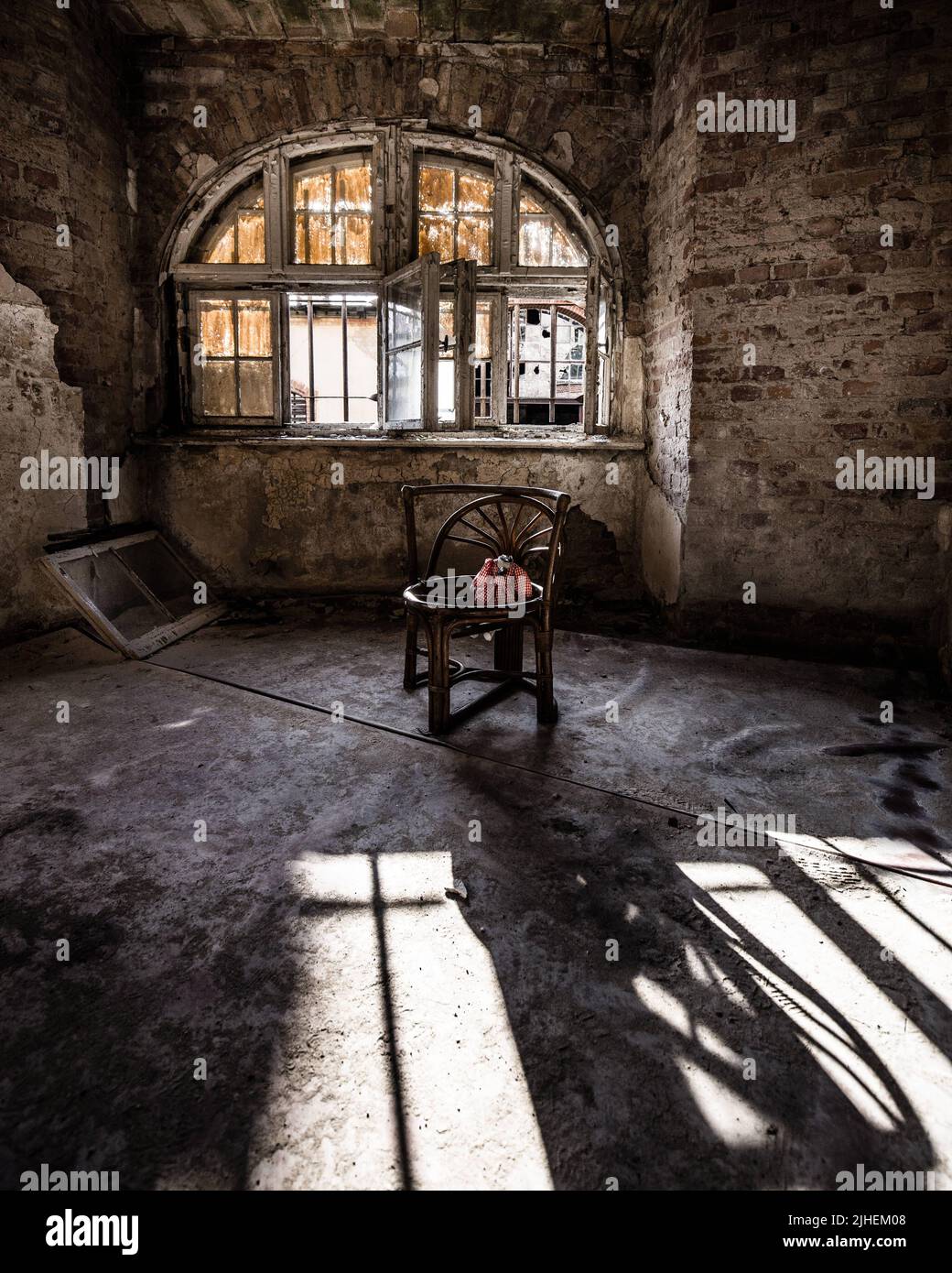 A spooky scene with an abandoned object seated on a chair. BEELITZ ...