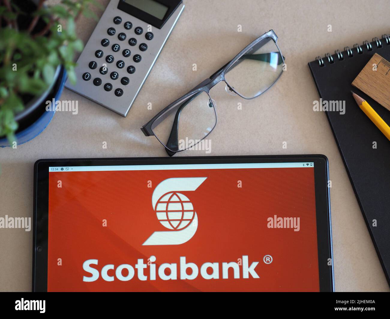 In this photo illustration, ScotiaBank logo seen displayed on a tablet ...