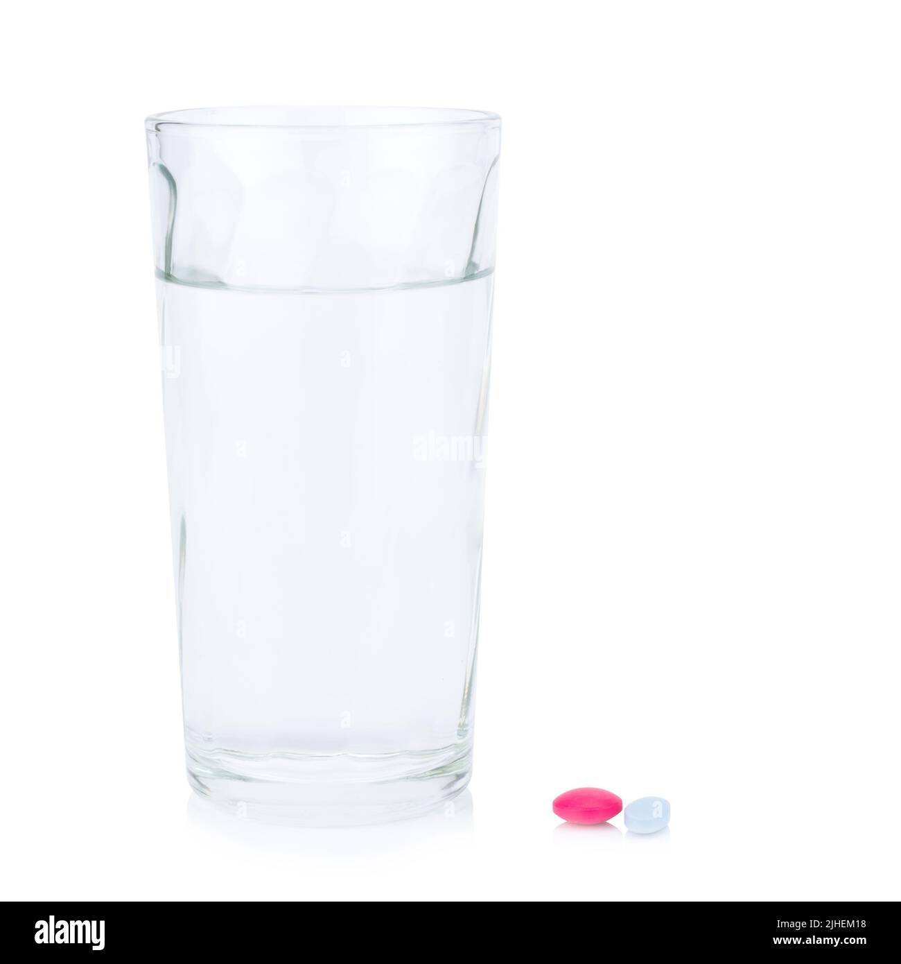 water glass. water glass. pill and tablet color red and blue.Take a ...