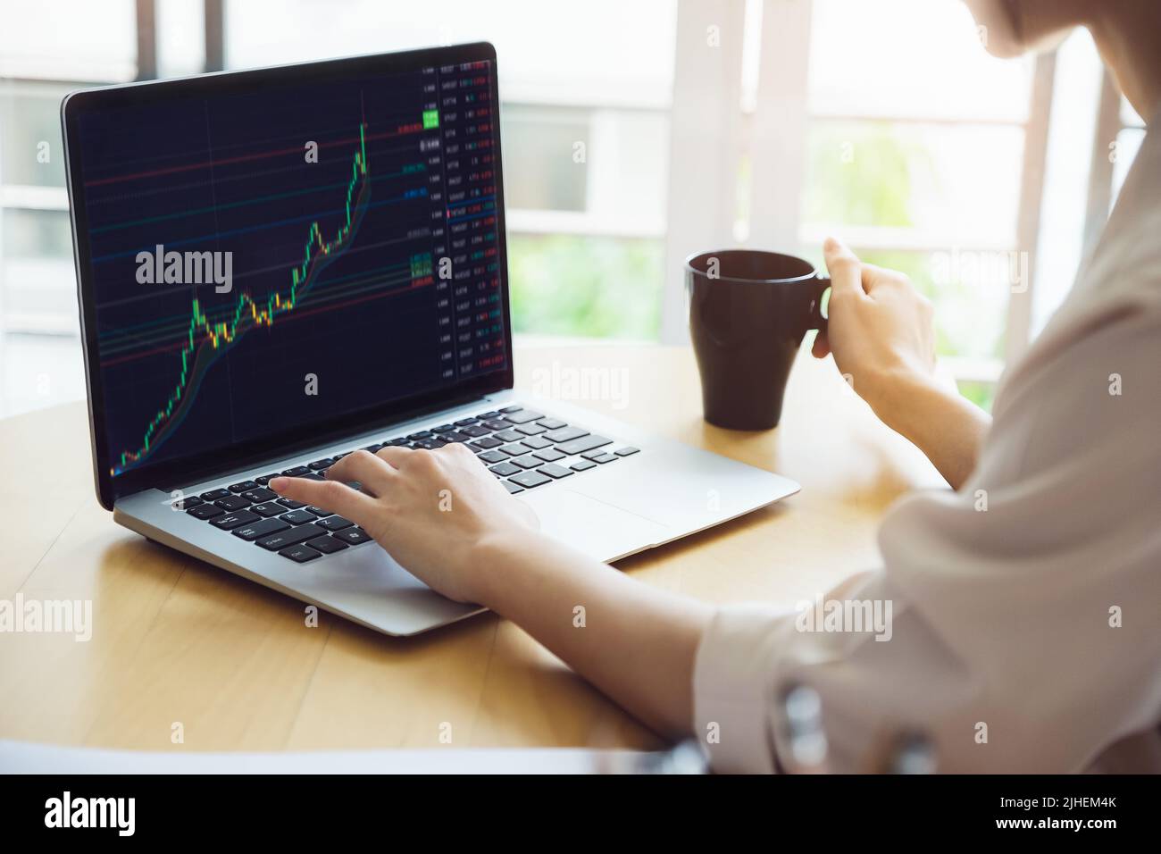 New normal, self-employed women are using a computer laptop to trade ...