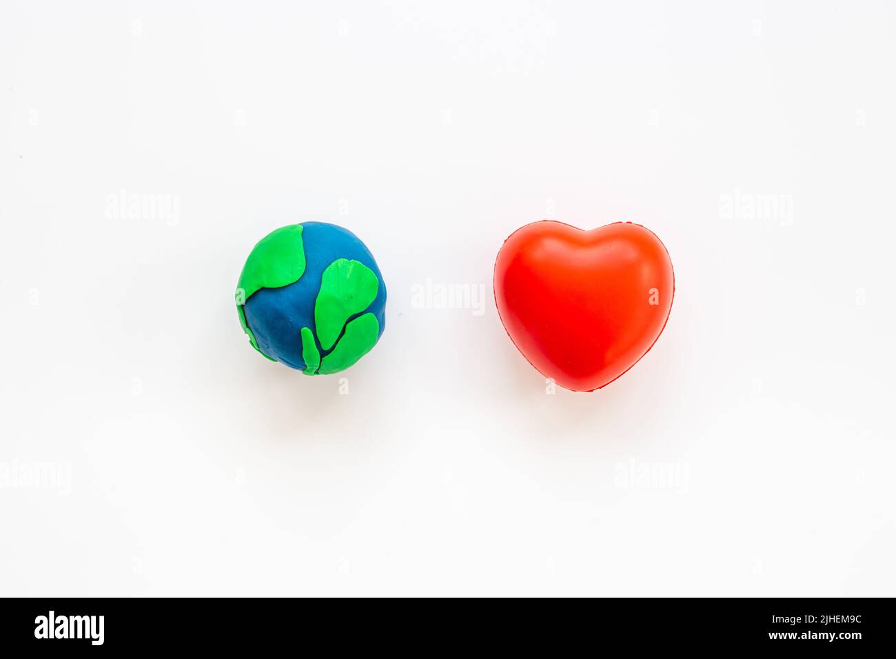 Clay world with heart. Eco and Earth Day concept Stock Photo - Alamy