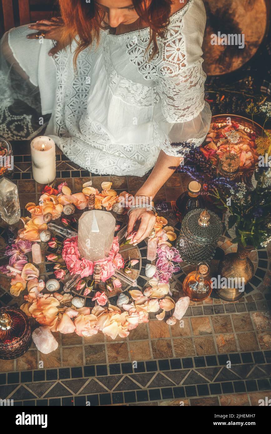 beautiful altar with crystals and rose flowers Stock Photo - Alamy