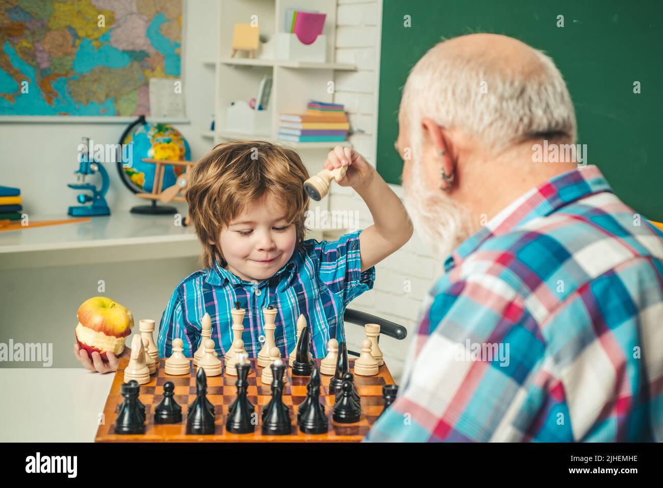 Family relationship between grandfather and grandson. Grandpa teaching ...
