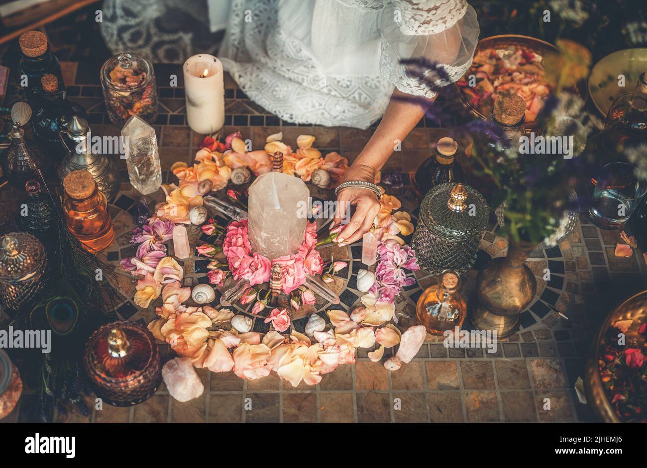 beautiful altar with crystals and rose flowers Stock Photo - Alamy