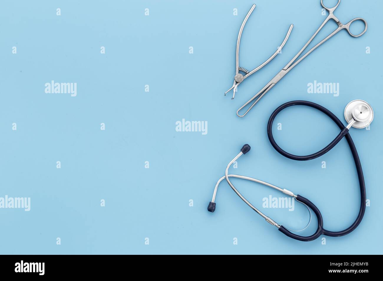 Dental or surgical steel instruments with stethoscope. Healthcare ...