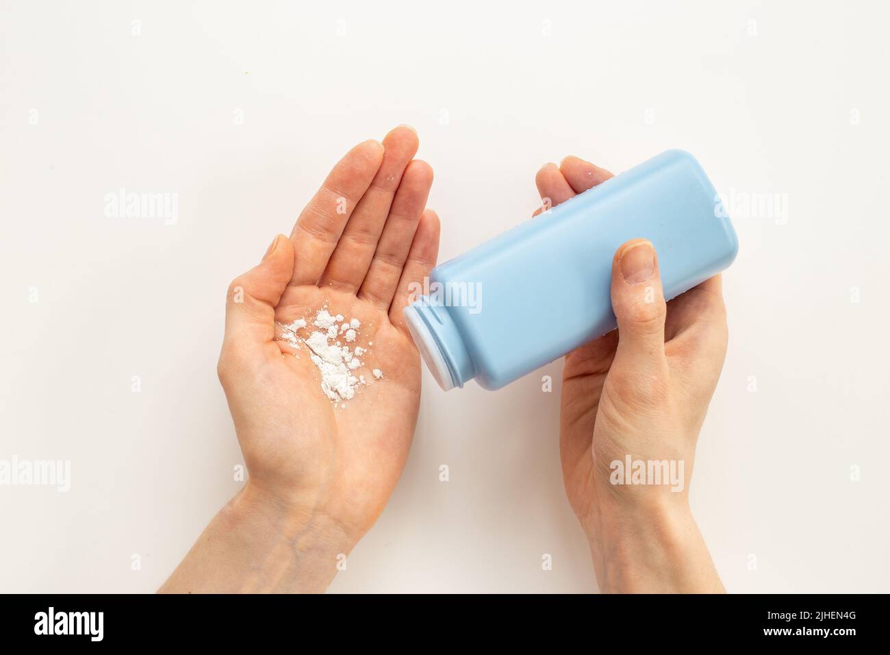 Applying white talcum powder on hand. Skin care cosmetic Stock Photo ...