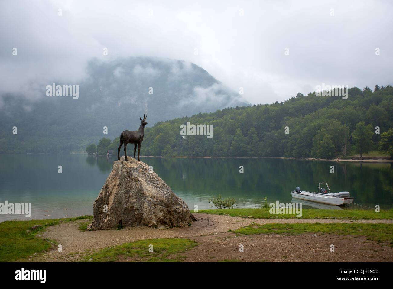 Zlatorog statue by Lake Bohinj Stock Photo - Alamy
