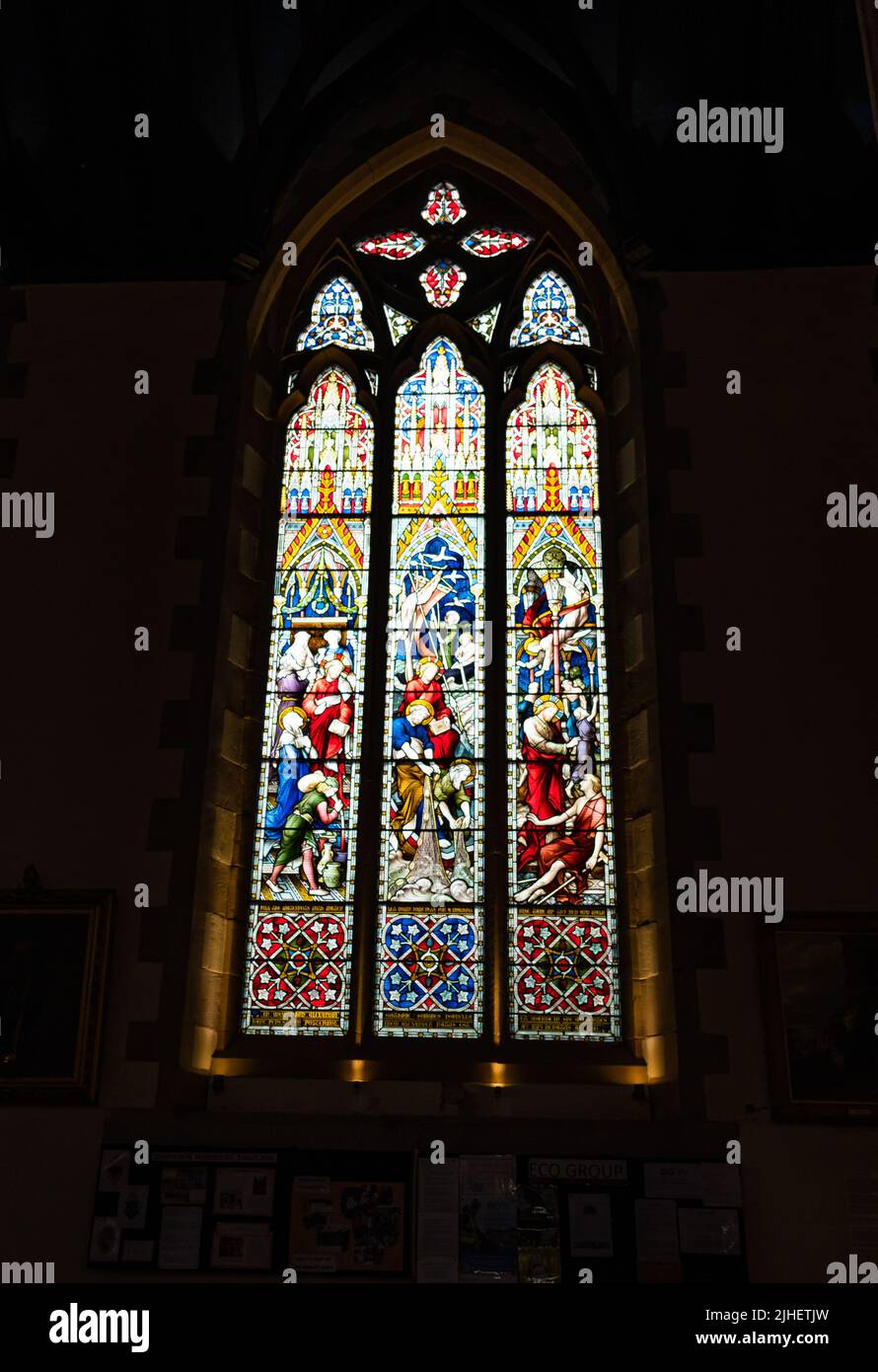 Traditional and ornate stained-glass window in a small church Stock ...