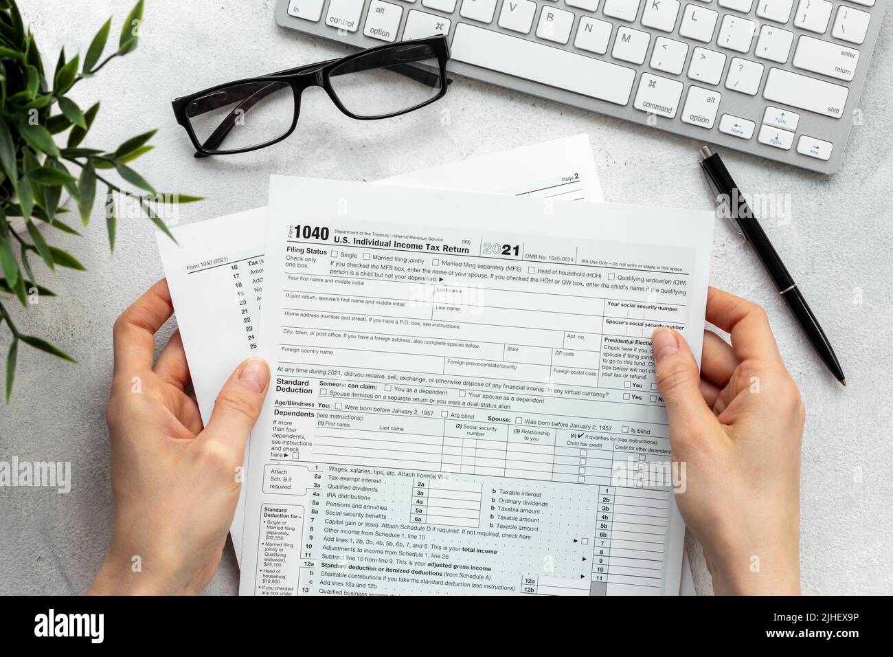 Accountant culculate taxes - US tax form on office table desktop Stock ...