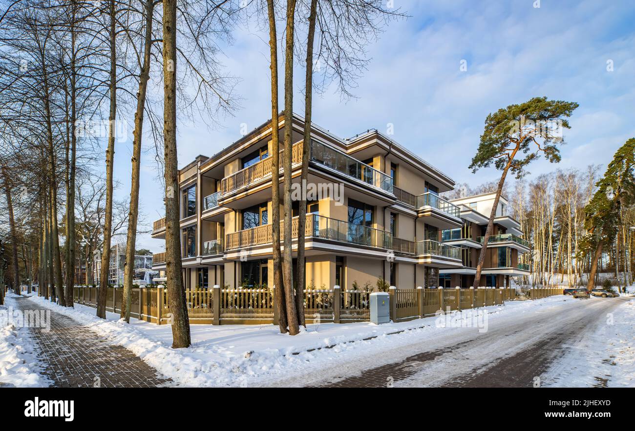 Modern exterior of new luxury residential building at winter. Private ...
