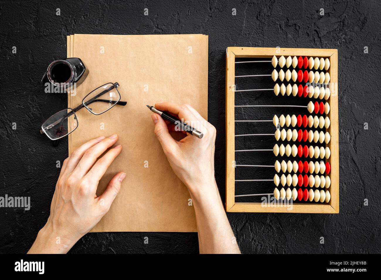 Accounting wooden abacus with blank sheet of paper. Financial ...