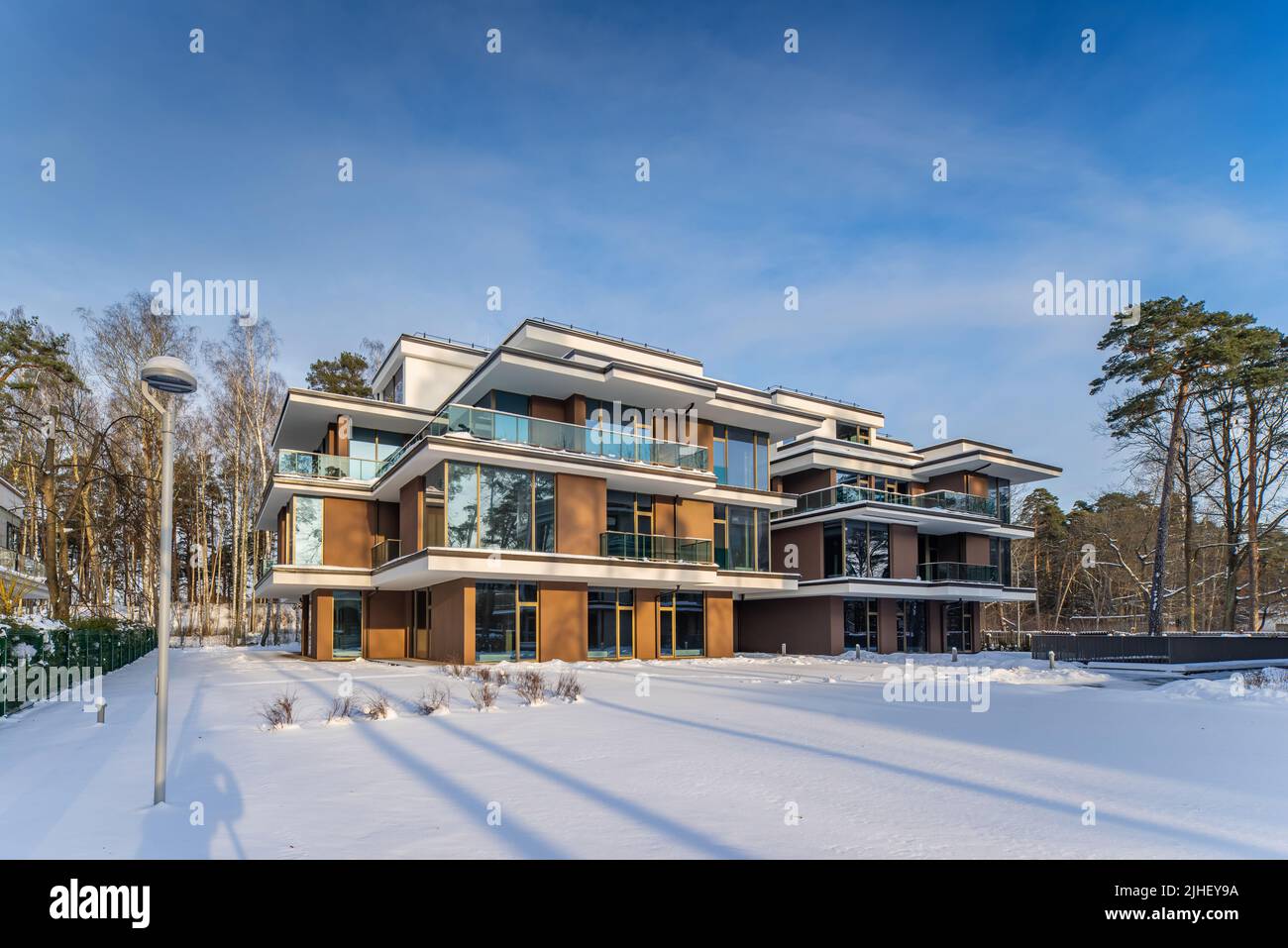 Modern exterior of new luxury residential building at winter. Snow in ...