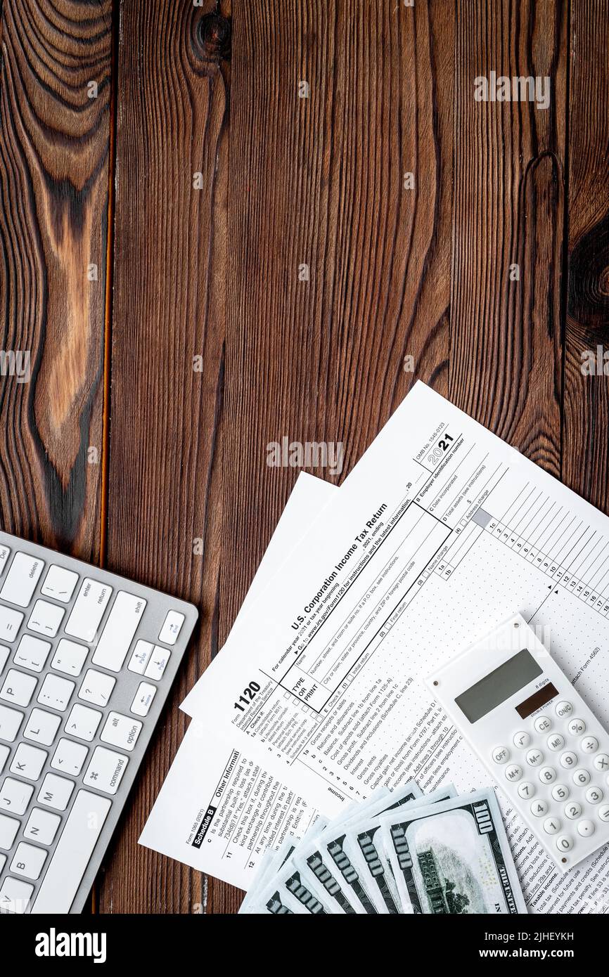 Accountant culculate taxes - US tax form on office table desktop Stock ...