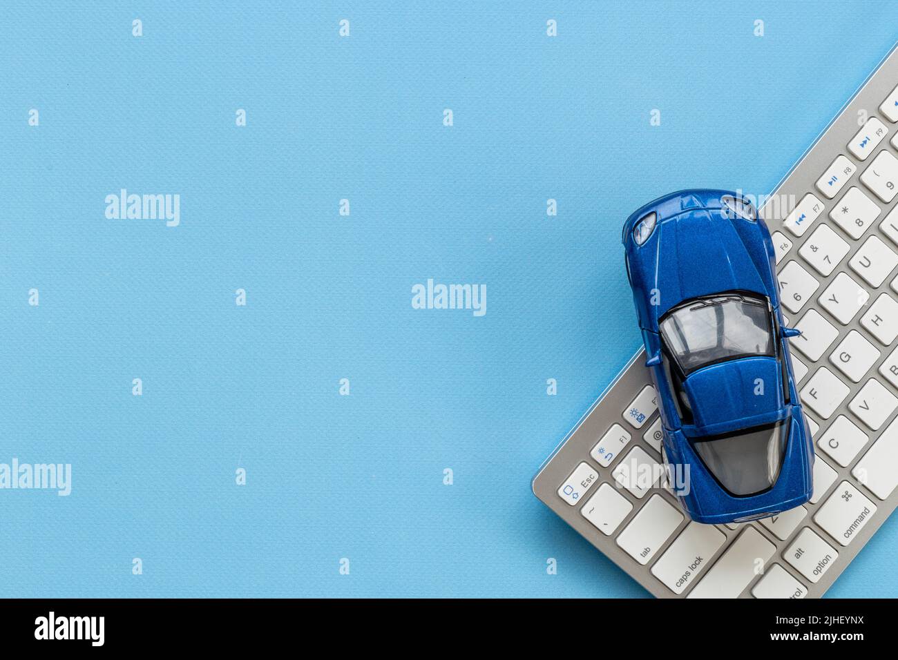 Toy car near computer keyboard - rent or purchase a car concept Stock ...