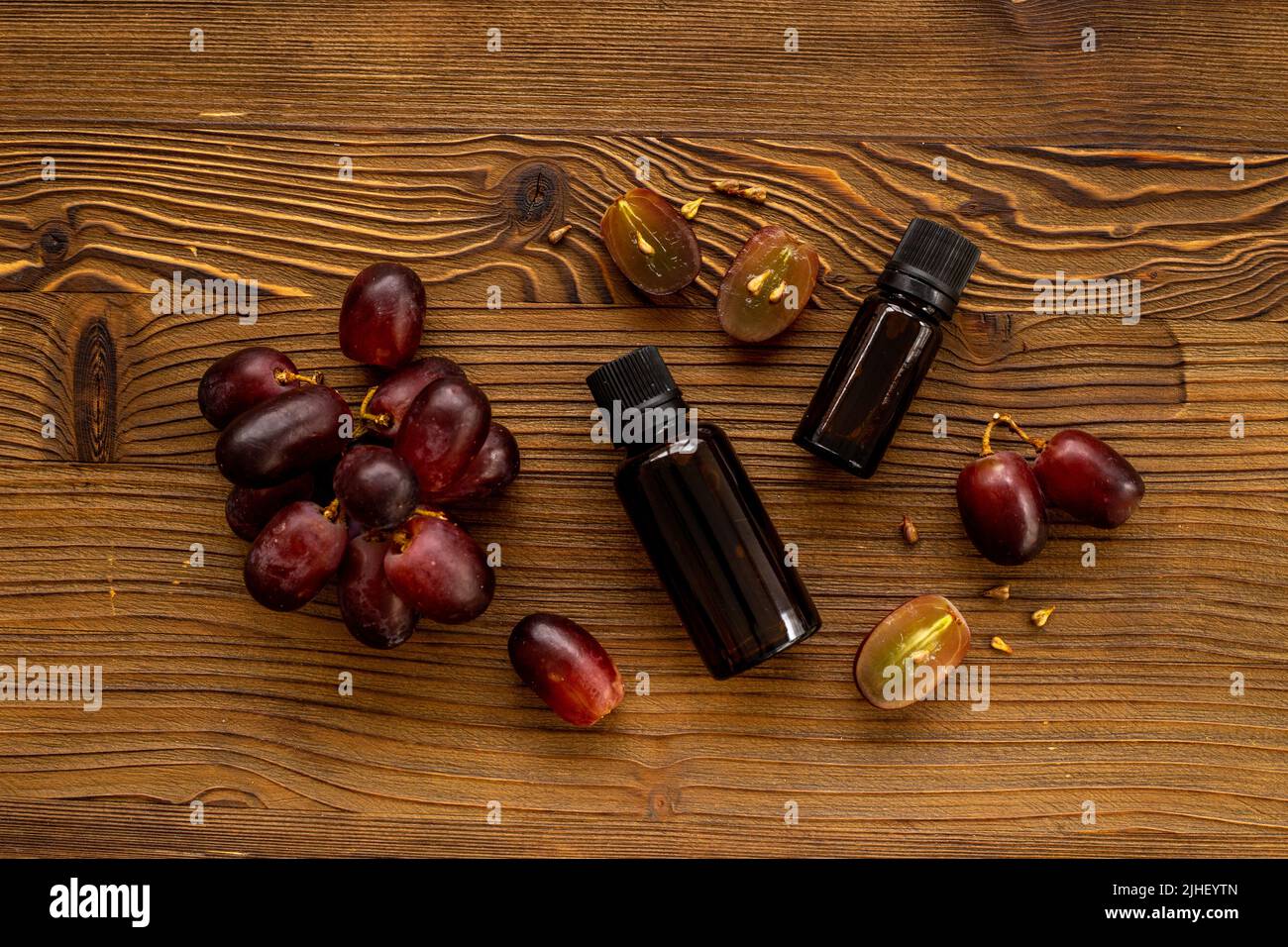 Skin care cosmetic - grape seed oil with grapes berries Stock Photo - Alamy
