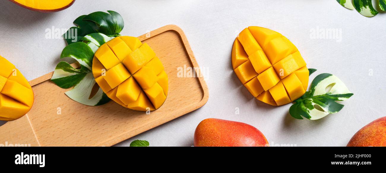Mango background design concept. Top view of diced fresh mango fruit ...