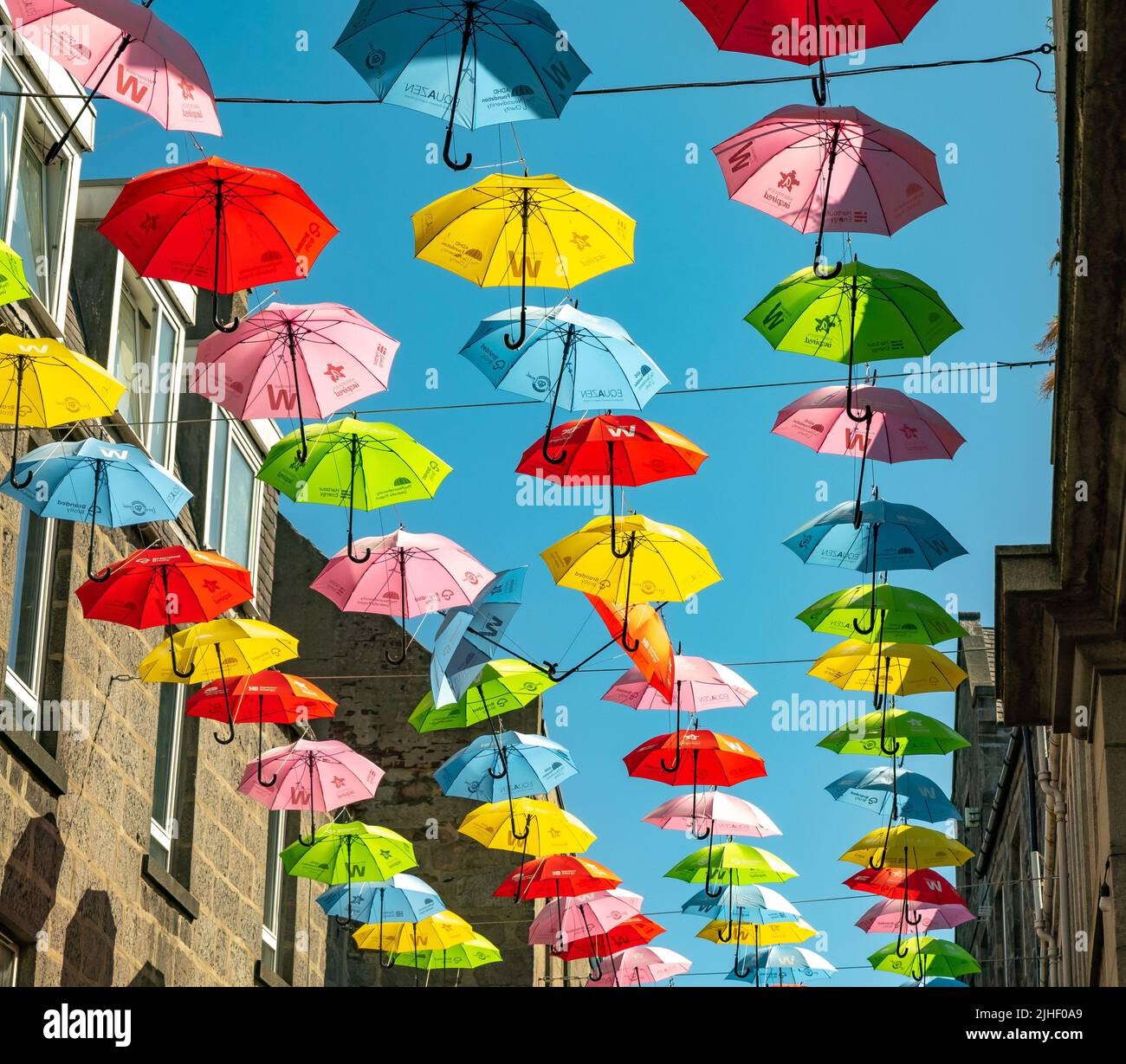 Aberdeen, Scotland, UK – June 26 2022. Colourful umbrellas suspended ...