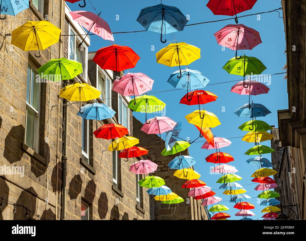 Aberdeen, Scotland, UK – June 26 2022. Colourful umbrellas suspended ...