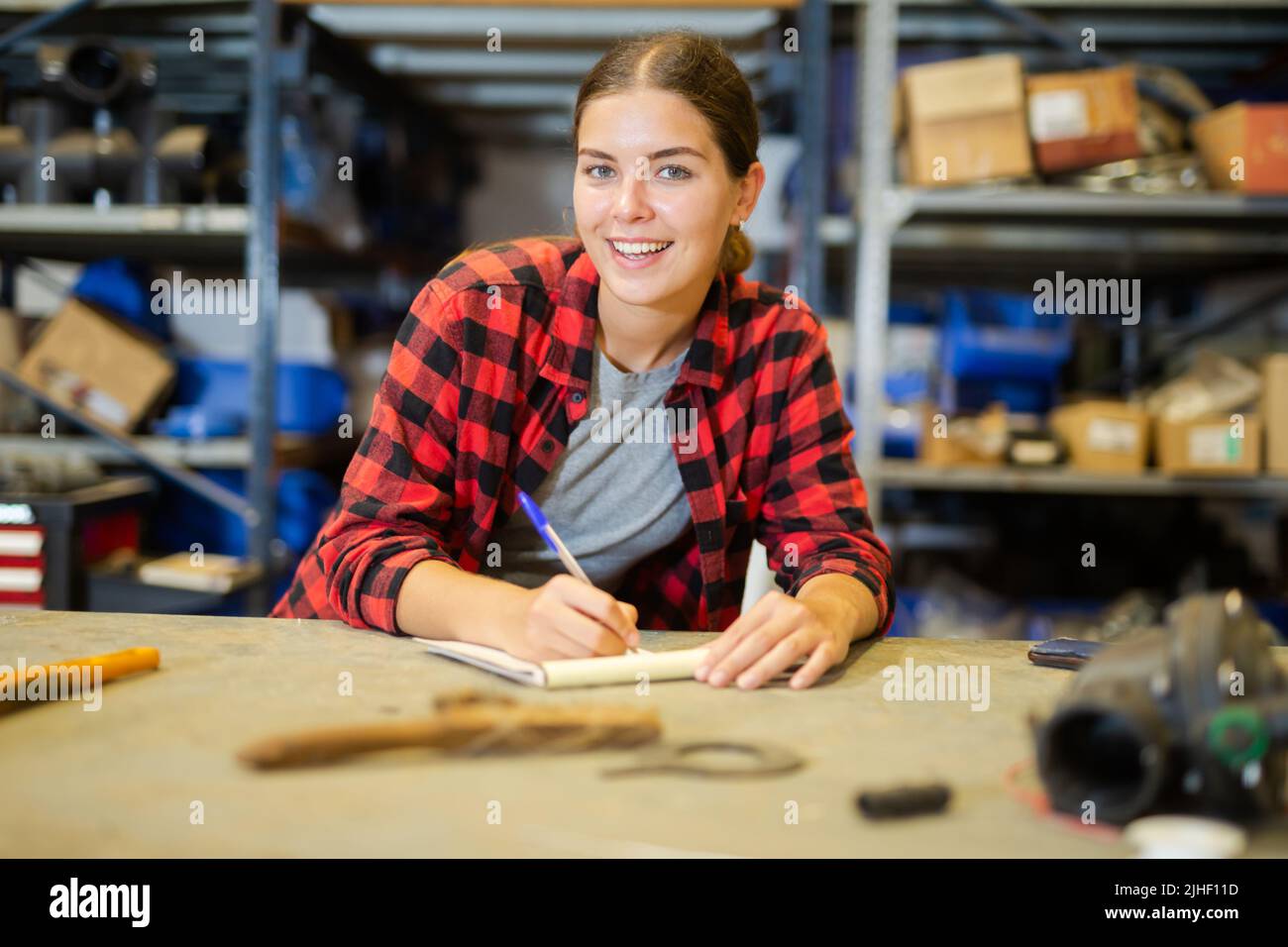 Young smiling girl checking order list Stock Photo - Alamy