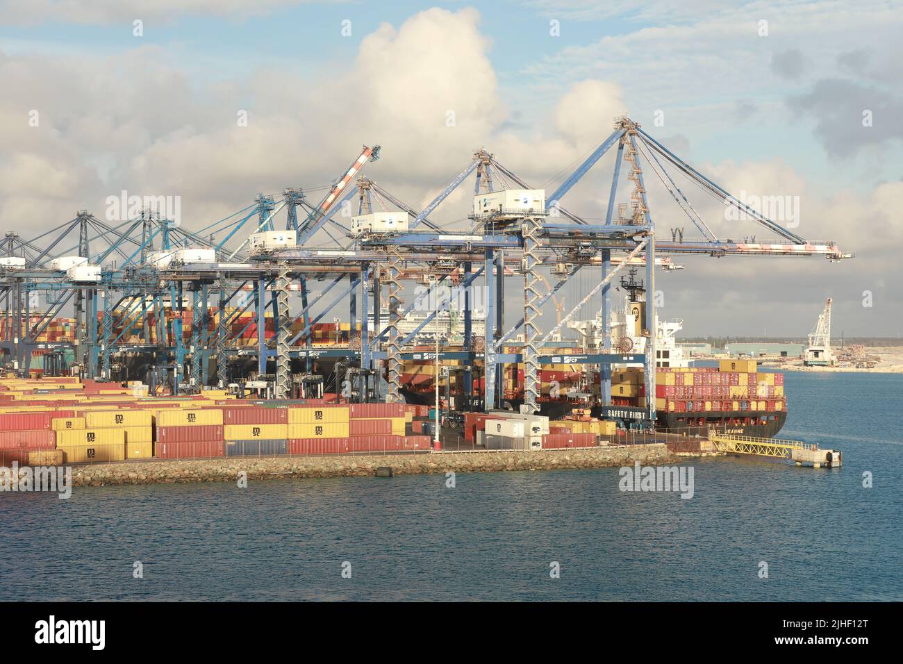 Container ship at industrial port in import export business logistic ...