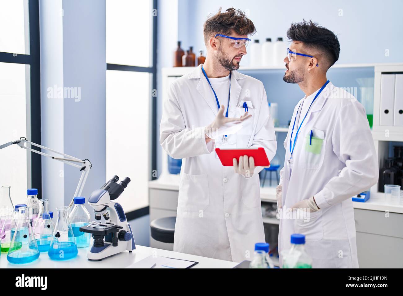 Young couple wearing scientist uniform hi-res stock photography and ...