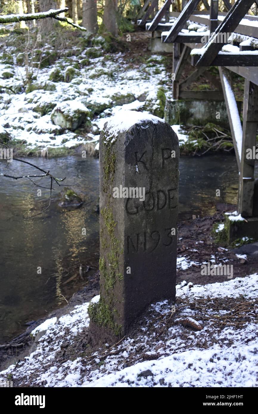 The vertical view of an old border marking stone in Germany Stock Photo ...
