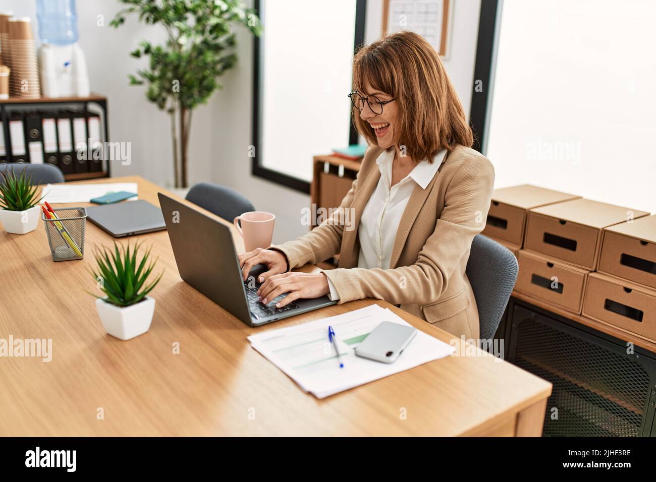 Young caucasian businesswoman smiling happy working at the office Stock ...