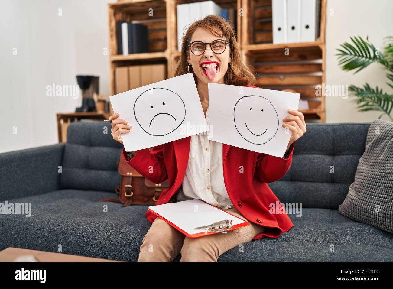 Young beautiful woman working on depression holding sad to happy ...