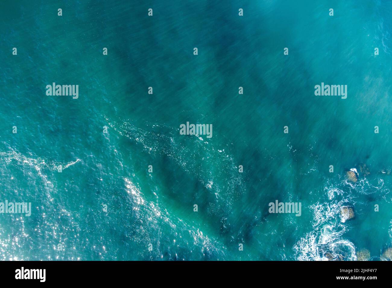 Aerial view of a crystal clear sea water texture. View from above ...