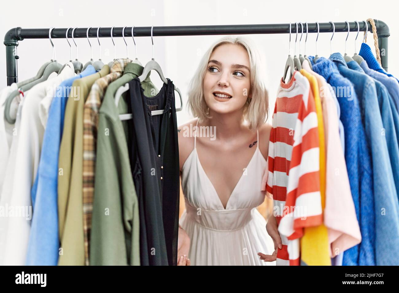 Young caucasian woman smiling confident appearing through clothes at ...