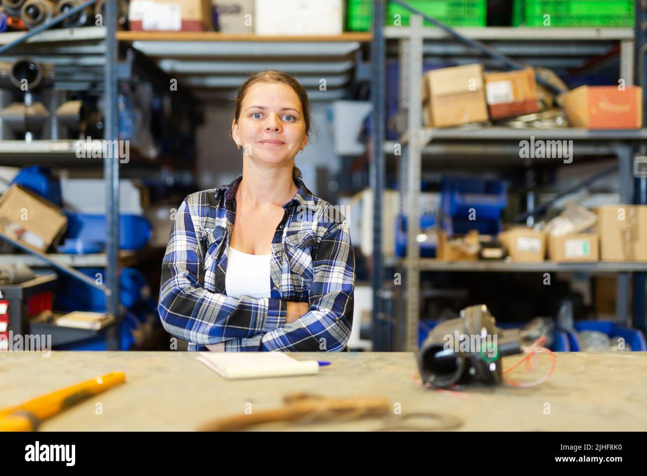 Portrait of positive woman warehouse worker Stock Photo - Alamy