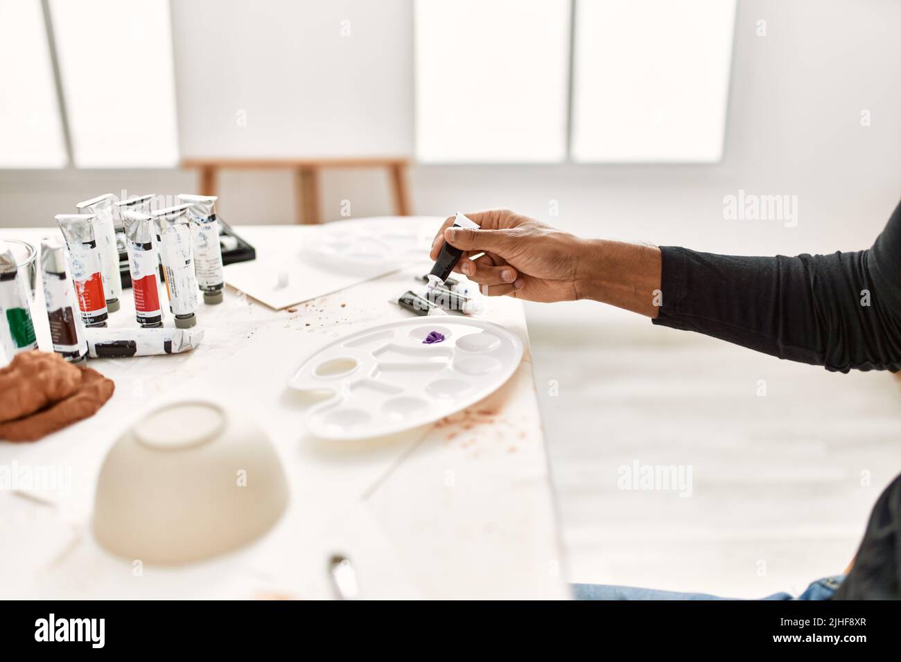 Hand of african american artist man painting at art studio Stock Photo ...