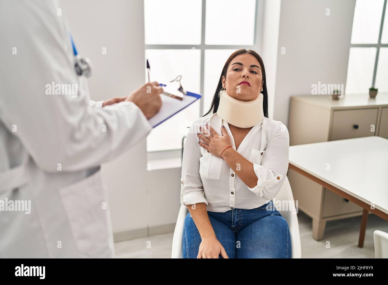 Man and woman doctor and patient having medical consultation for ...
