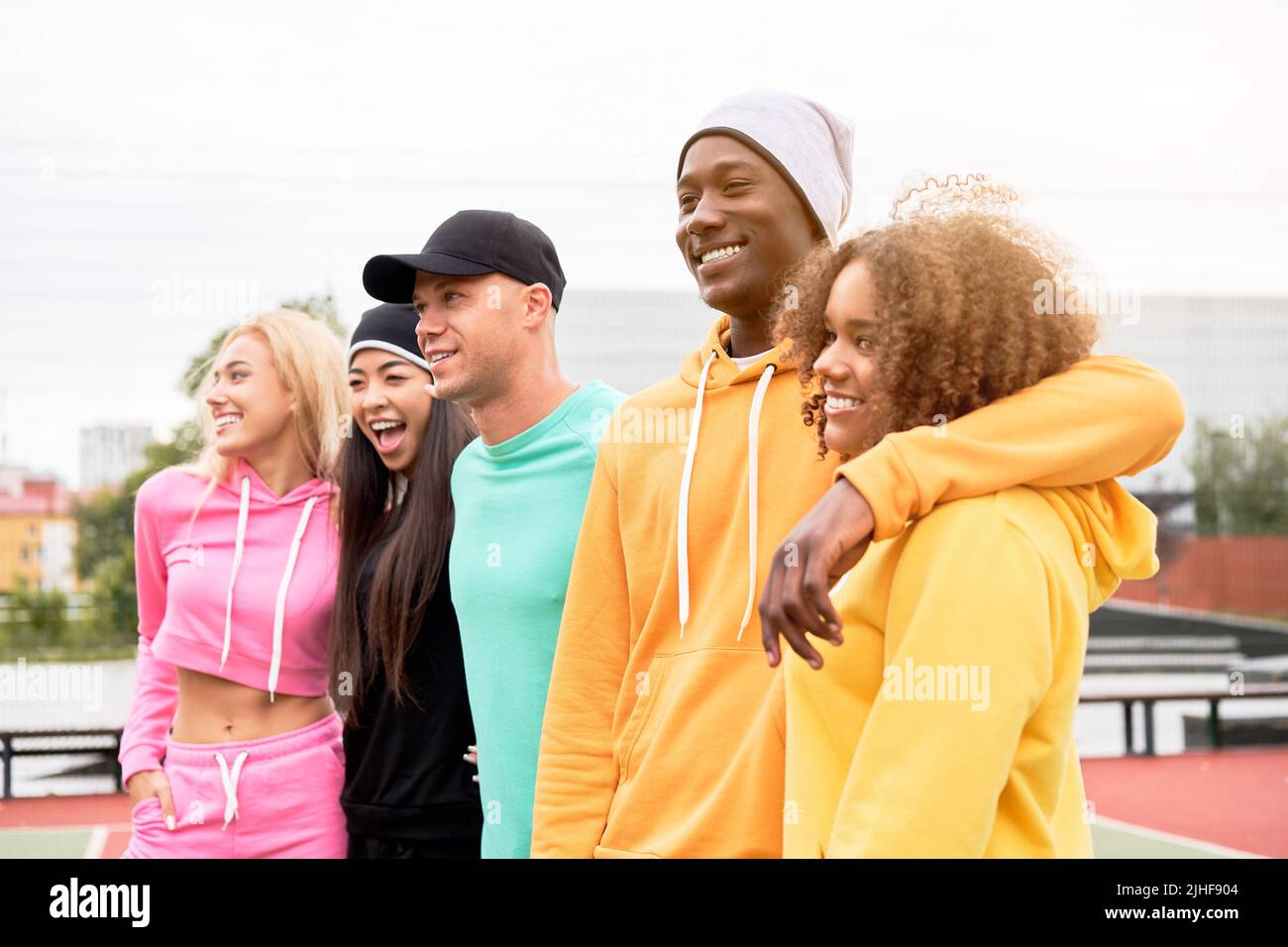 Group positive diverse friends sport hi-res stock photography and ...